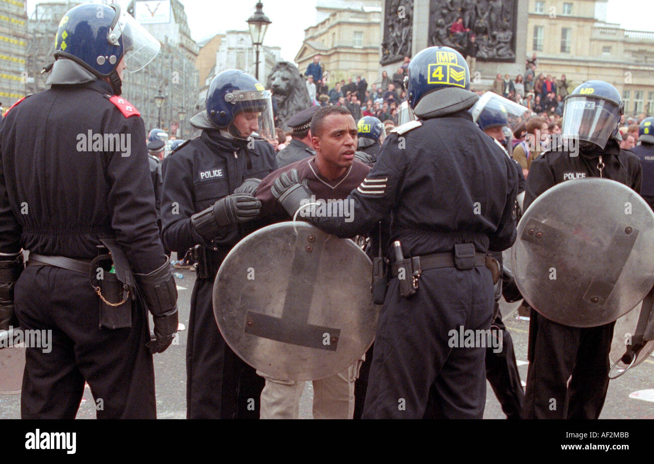 Black protesters stopped and arrested by riot police at Trafalgar ...