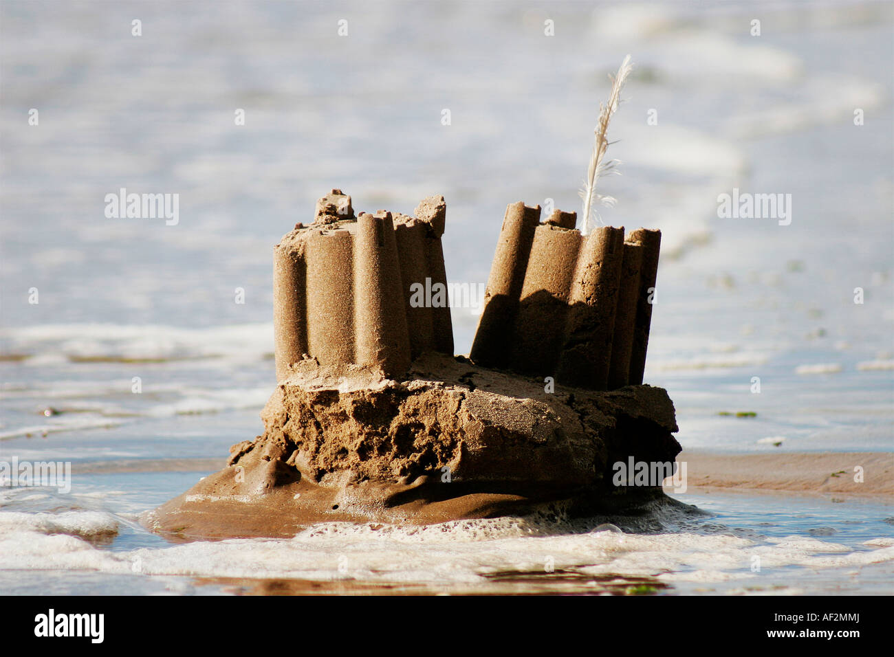 Sandcastle with Incoming Tide Wales UK Stock Photo - Alamy