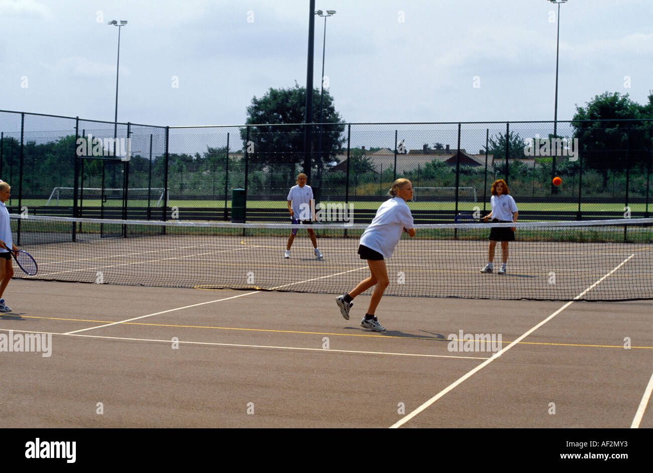 High School Physical Education Students Playing Tennis Stock Photo - Alamy