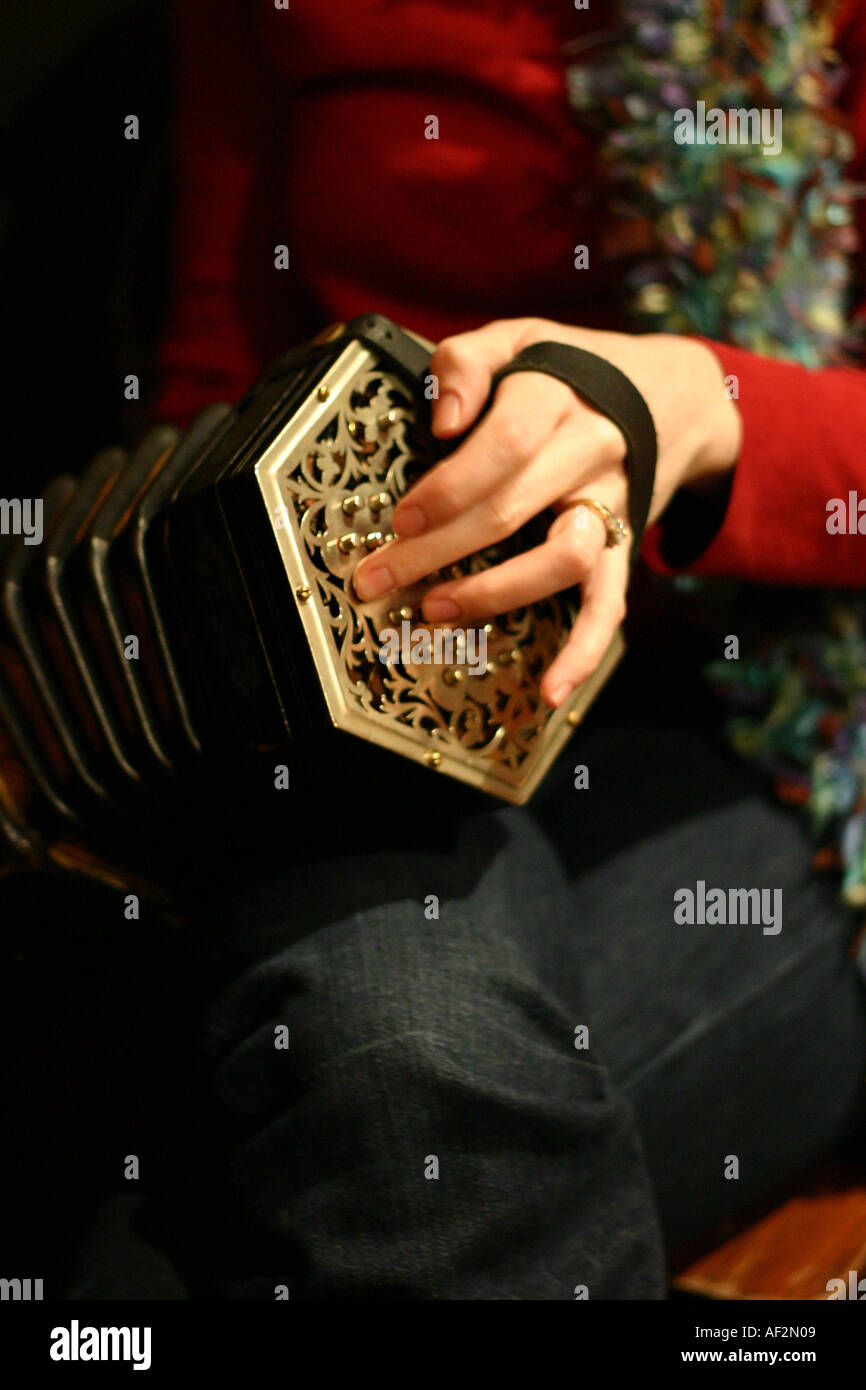 Woman playing concertina accordian Stock Photo - Alamy