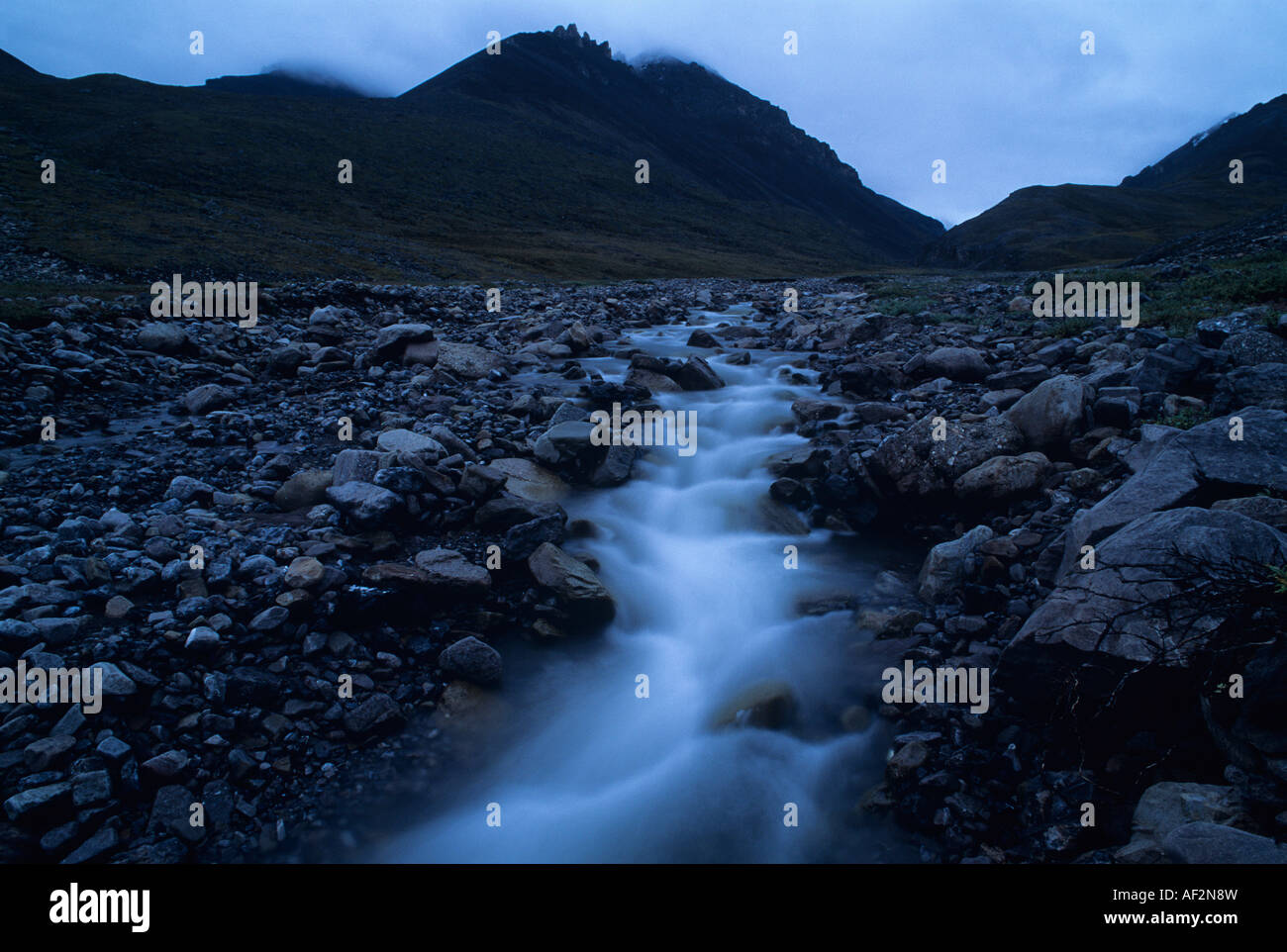 USA Alaska Gates of the Arctic National Park Small stream flows through ...