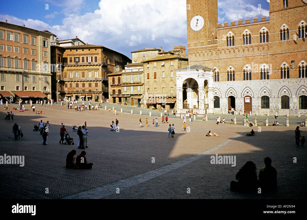 Siena Il Campo main square in sunset with people Stock Photo - Alamy