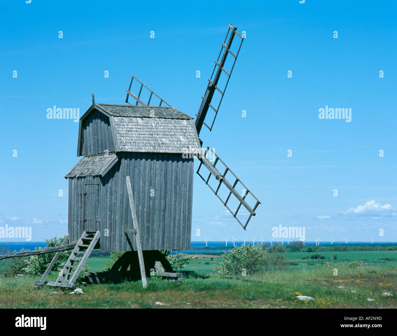 Traditional post mill wooden windmill and wind turbines, Gettlinge ...