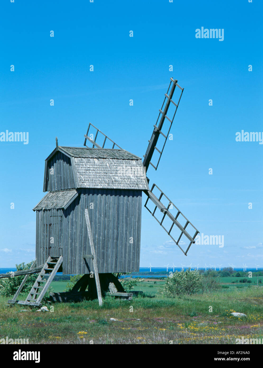 Traditional post mill wooden windmill and wind turbines, Gettlinge ...
