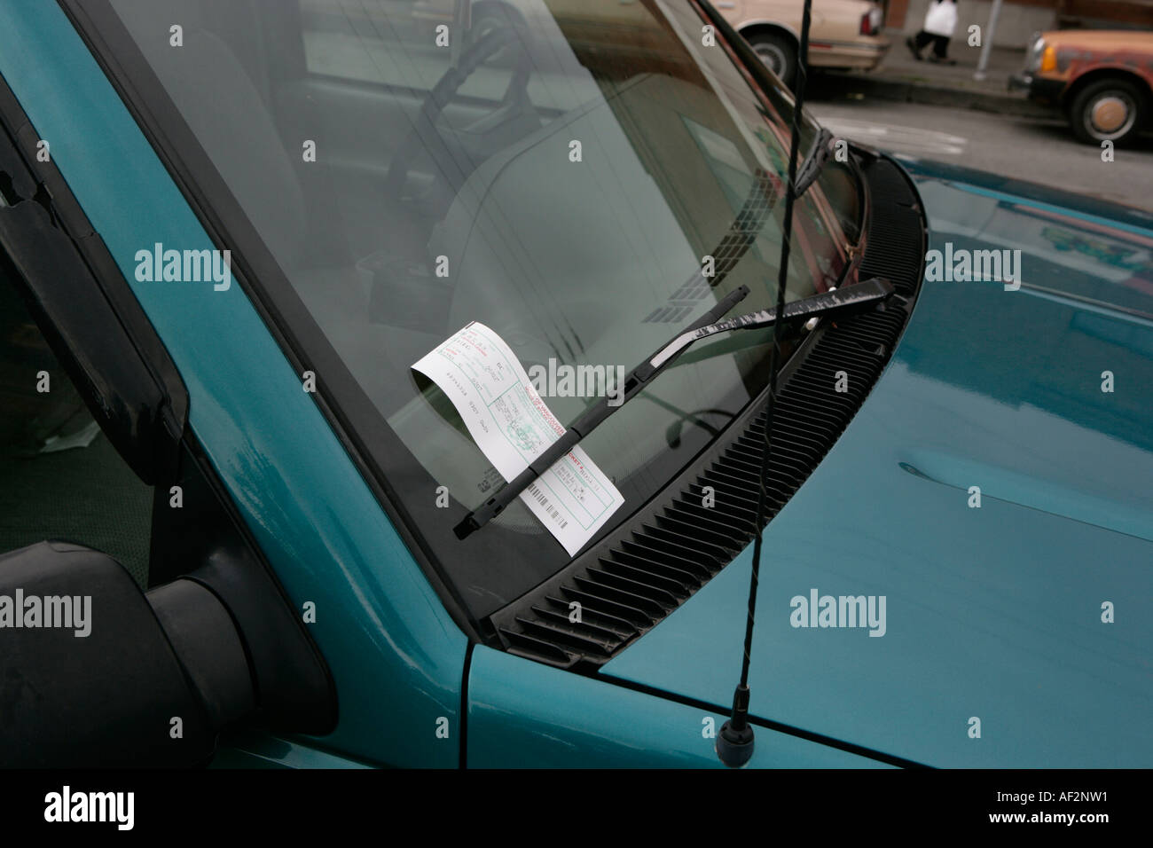 Parking violation ticket on windshield Stock Photo - Alamy