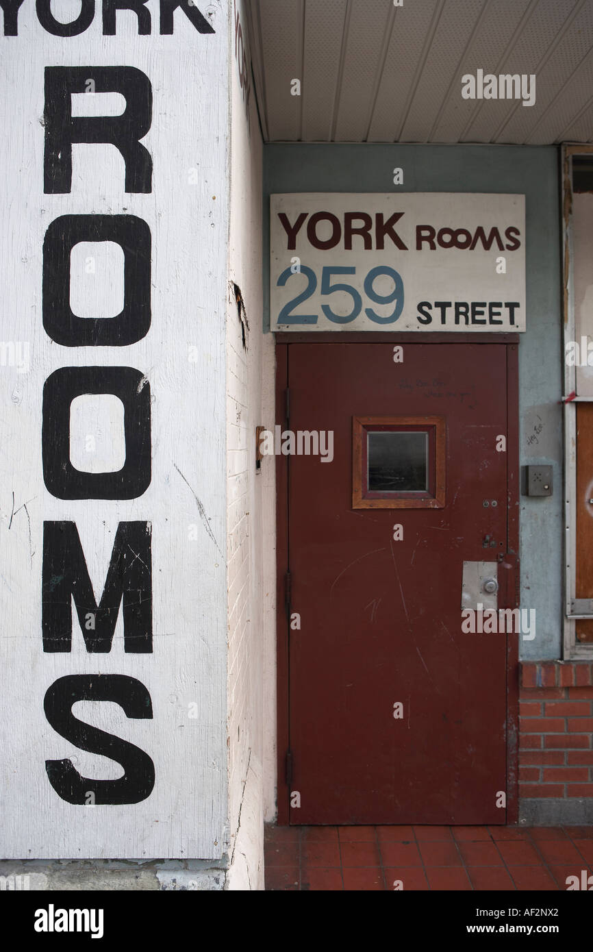 Eastside rooming house doorway and sign Stock Photo - Alamy
