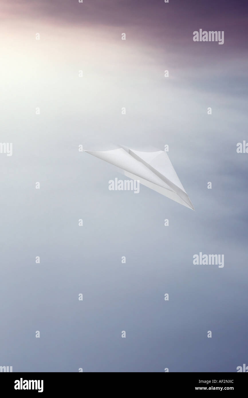 Paper plane flying through atmosphere Stock Photo - Alamy