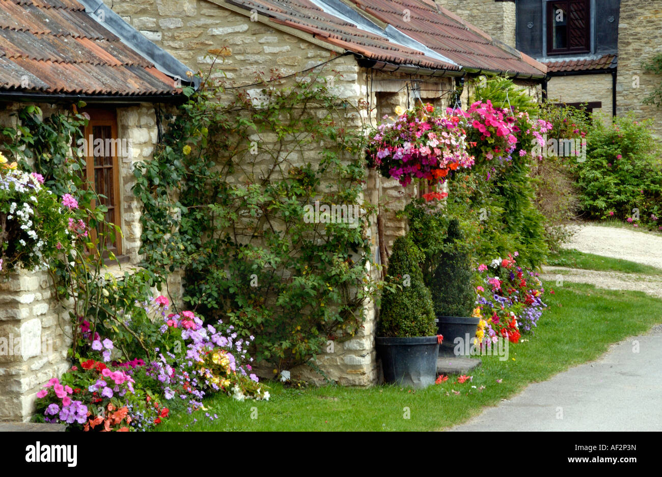 Small Cotswold cottages in Castle Combe Wiltshire England UK with ...
