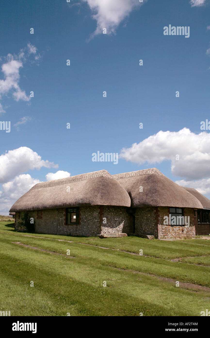 Two old English thatched stone barns housing mosaics from Bignor Roman ...
