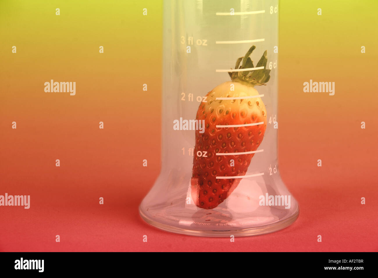 strawberry in a laboratory glass Stock Photo - Alamy