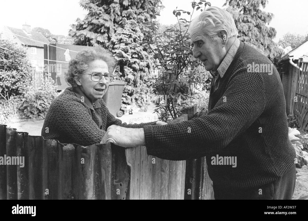 Neighbours Talking Over Fence High Resolution Stock Photography and ...