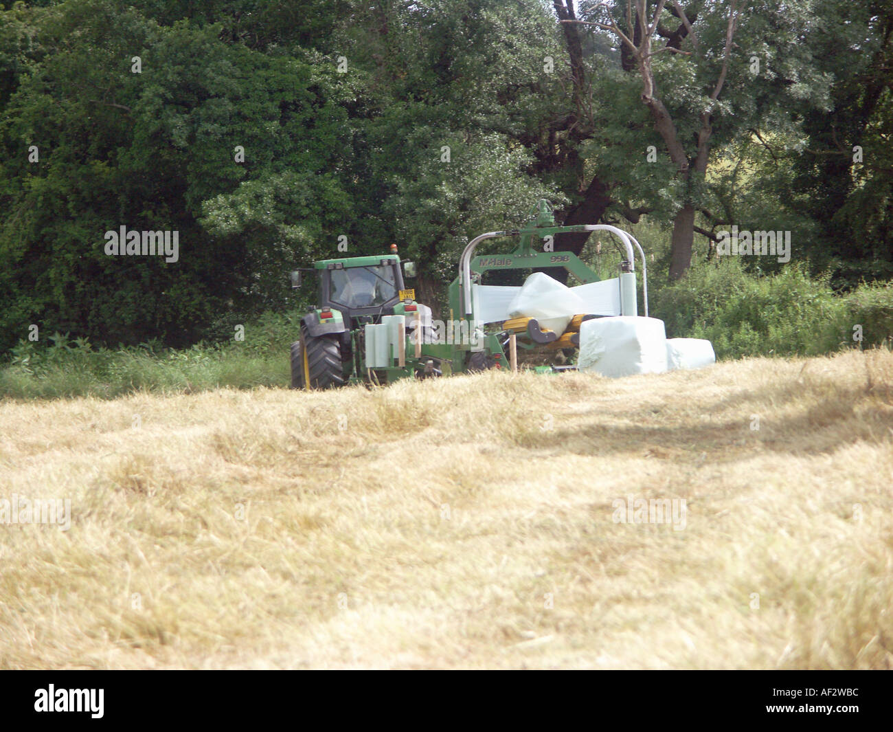 Hay bale wrapping machine hi-res stock photography and images - Alamy