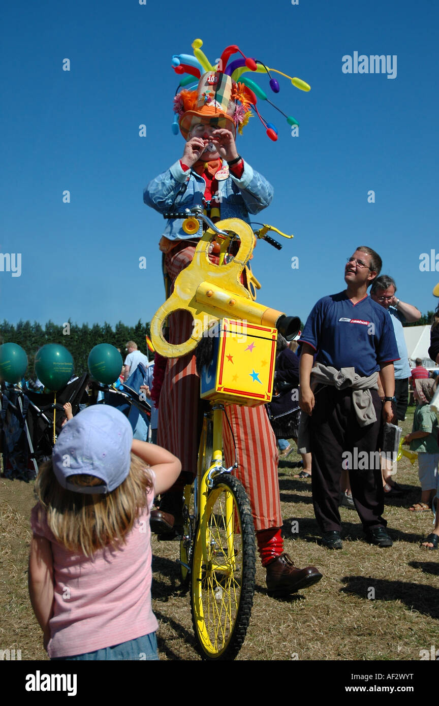 Clown On A Bicycle at The Isle of Wight, England UK Stock Photo - Alamy