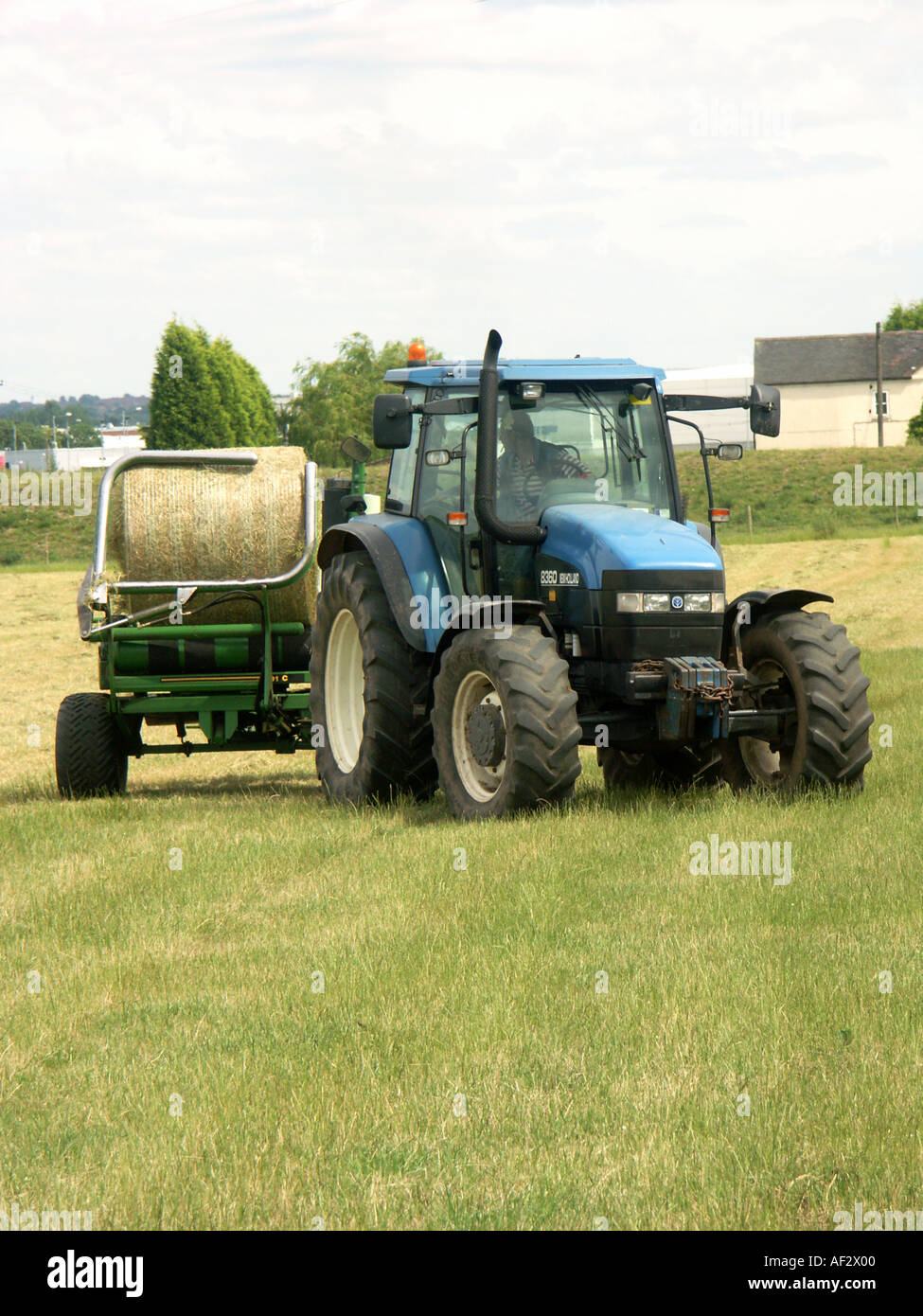 Tractor makes hay bales hi-res stock photography and images - Alamy