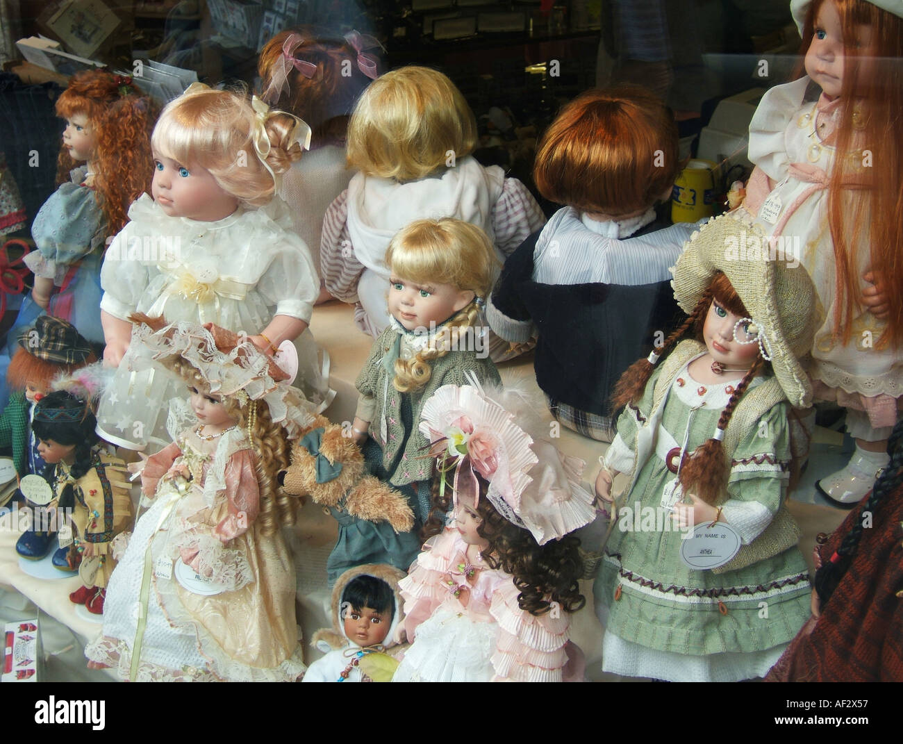 Display of traditional dolls in shop window Stock Photo - Alamy