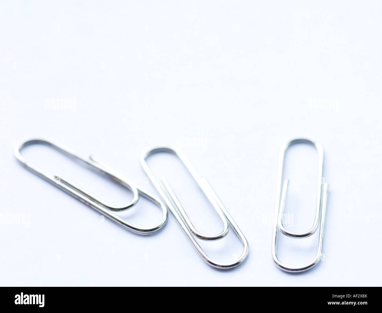 Paper Clips on white background Stock Photo - Alamy