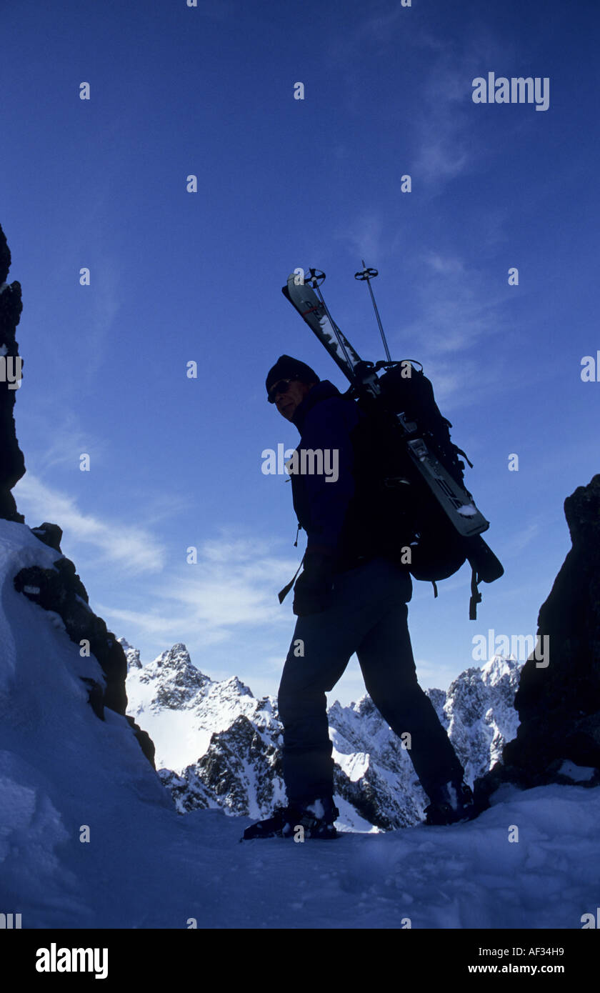 Silhouettes of ski alpinist on top of the Sedlo Prielom, High Tatra ...
