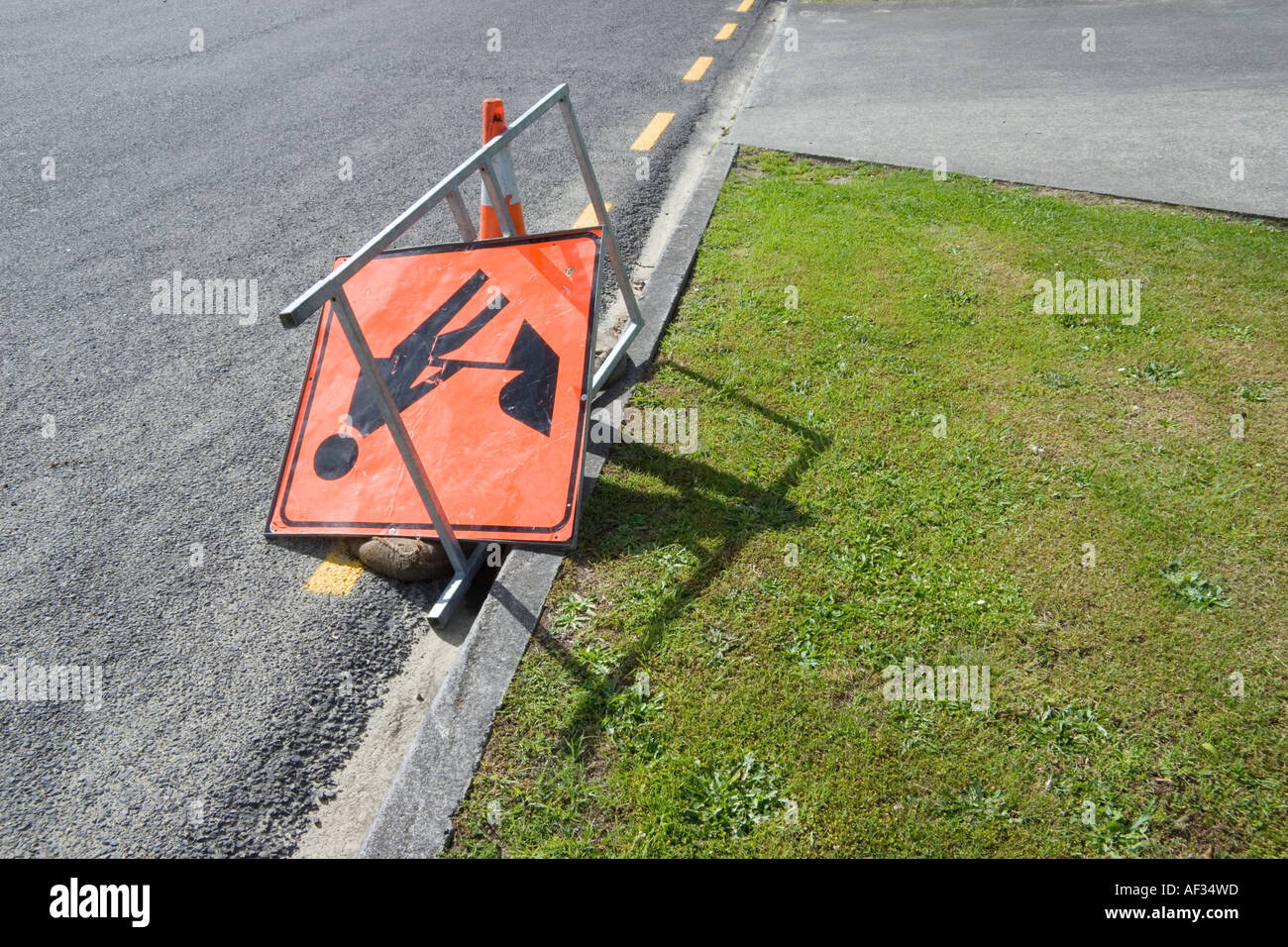 men working sign on ground Stock Photo - Alamy