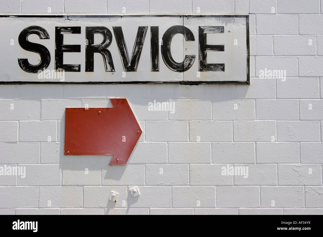 service sign with red arrow Stock Photo - Alamy