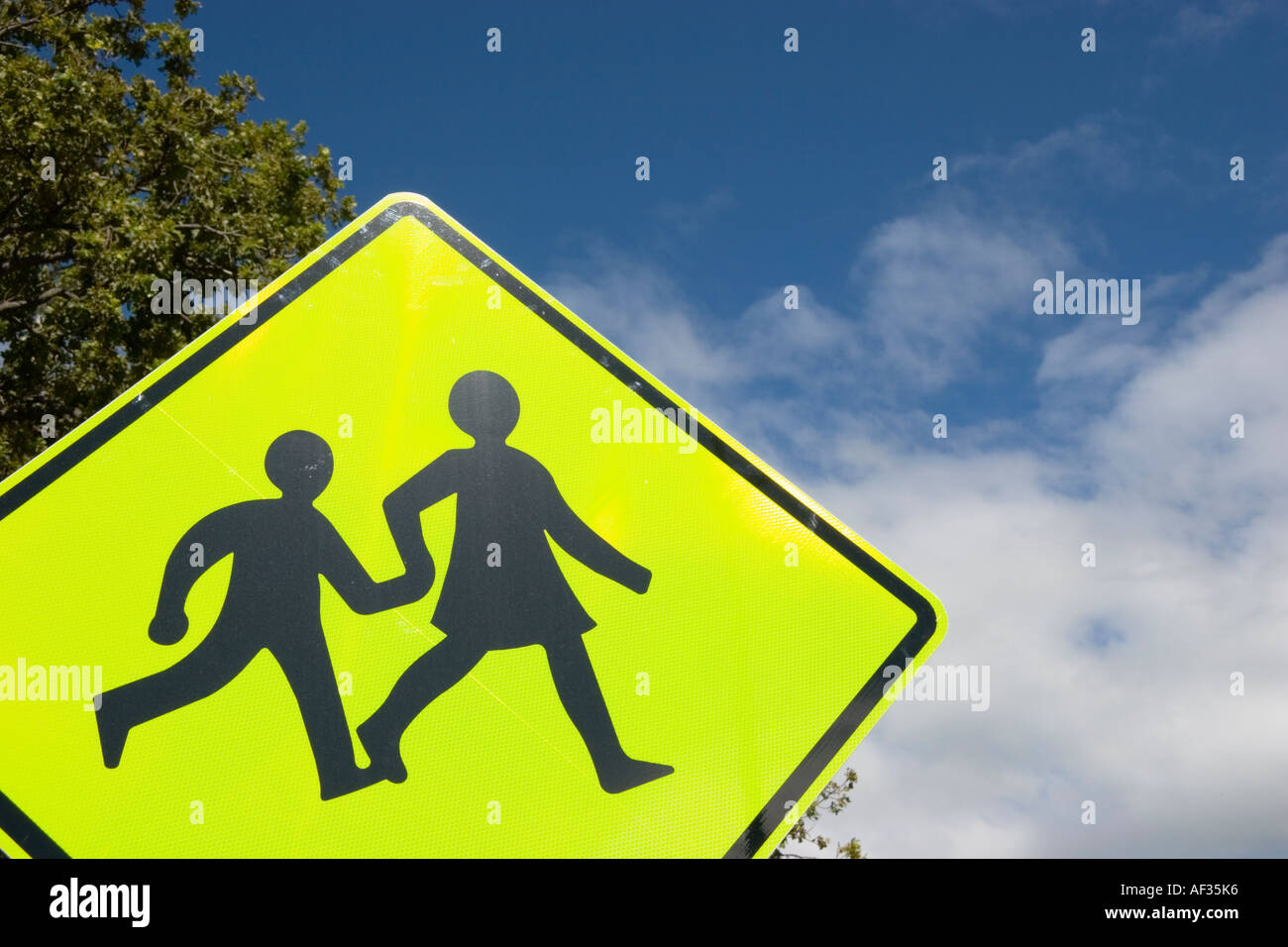 children crossing sign against blue sky Stock Photo - Alamy