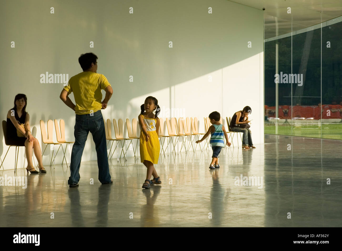 People in the foyer of the 21st Century Museum of Contemporary Art ...