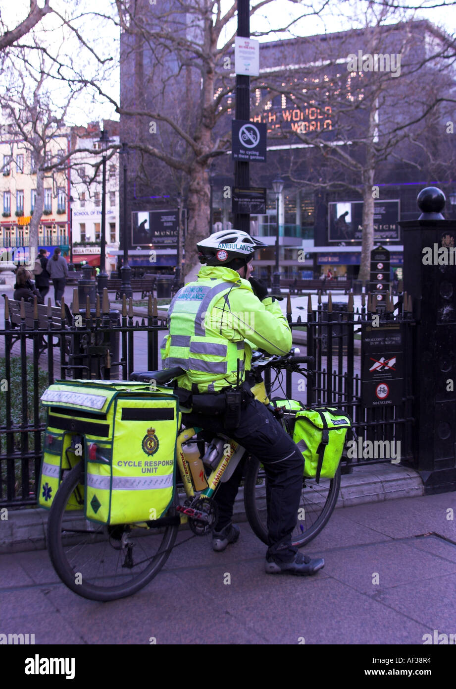 A bicycle paramedic dressed in bright green taking a break in Leciester ...