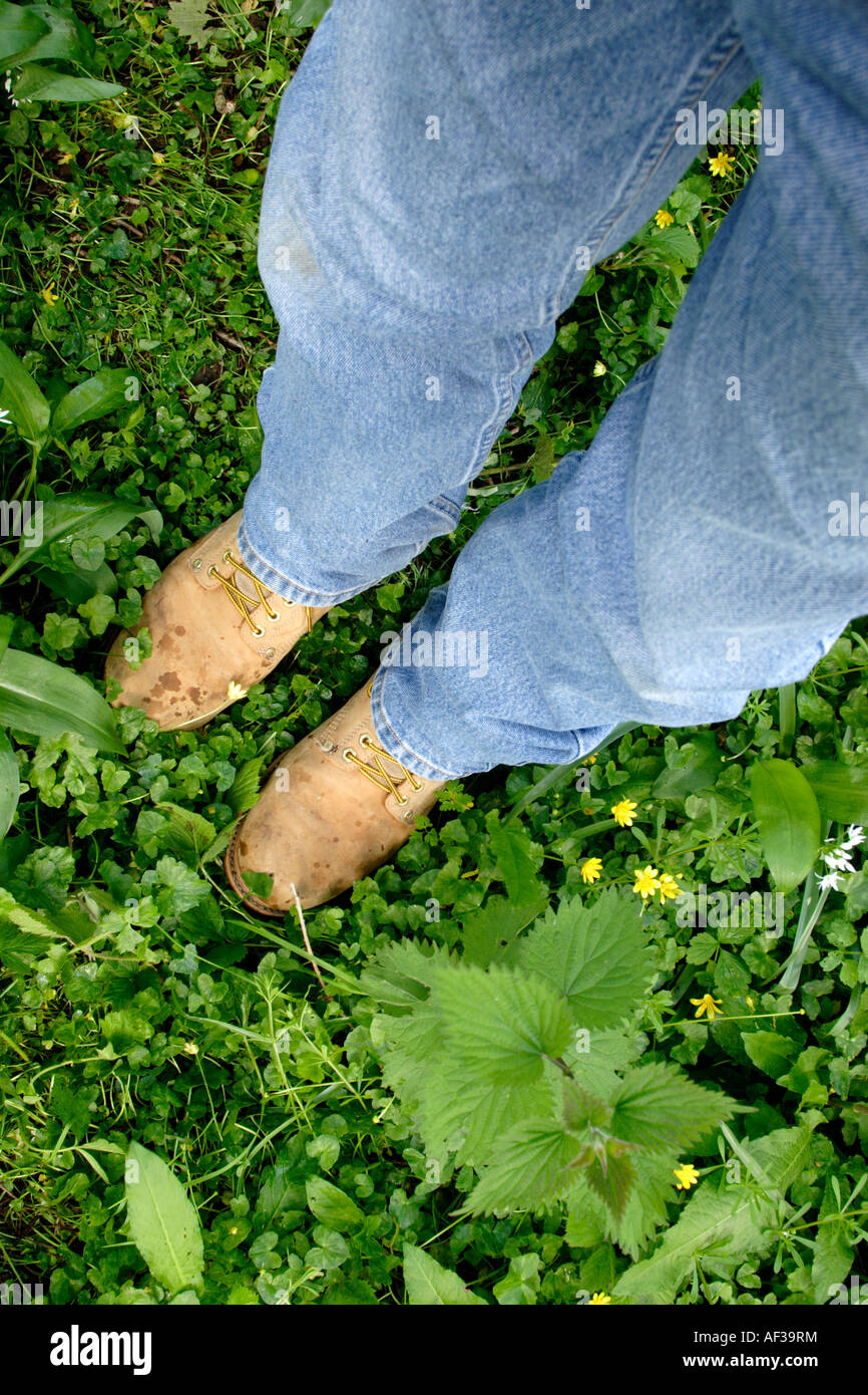 View down towards ground and persons feet and shoes Stock Photo - Alamy