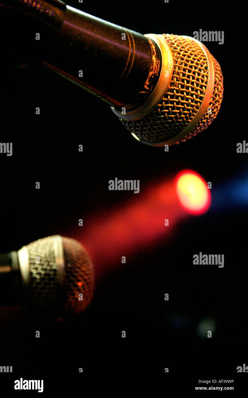 Microphones on an empty stage Stock Photo - Alamy