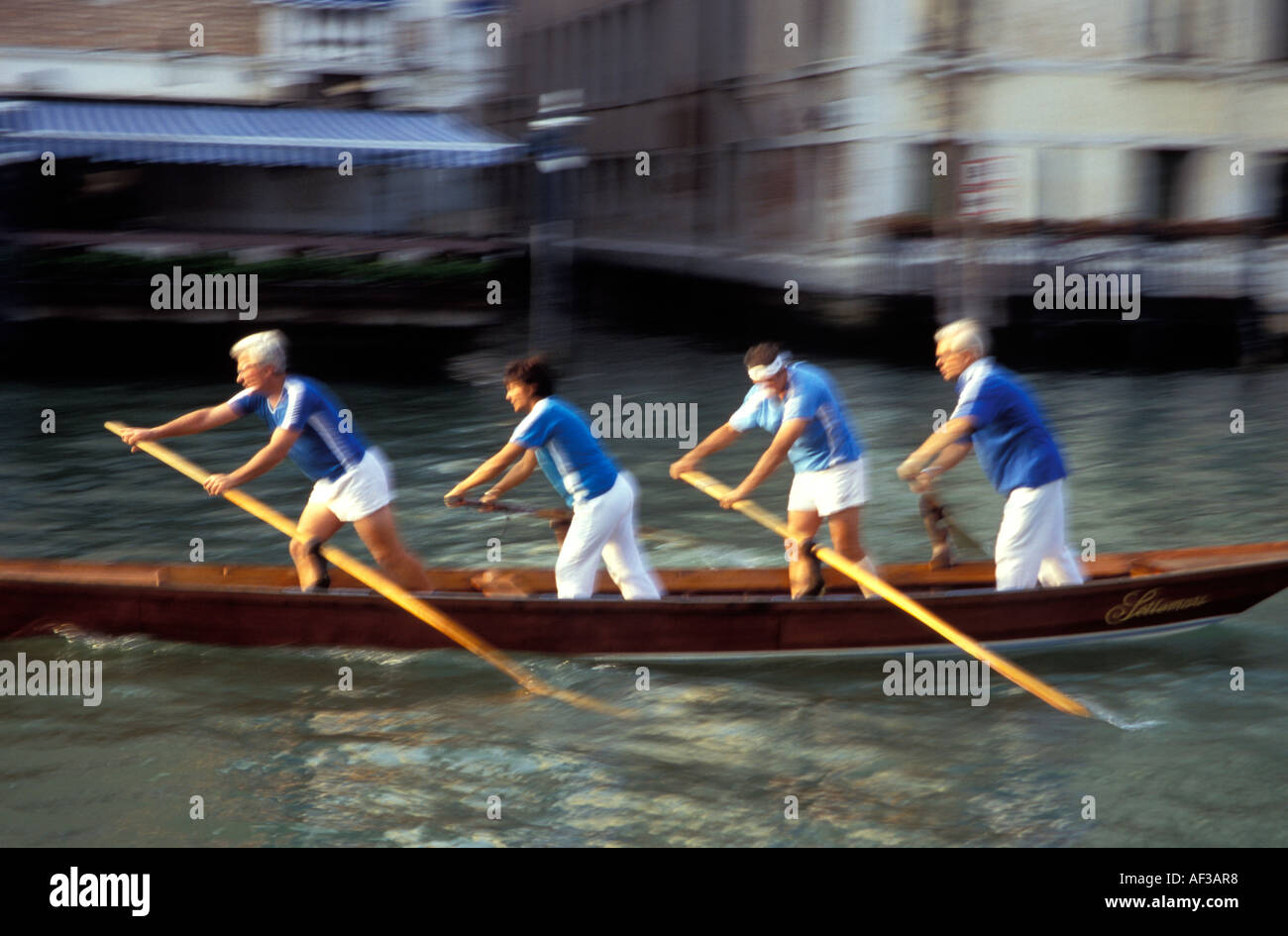 Middle-aged rowers in gondola on Canal Grande, Venice, Italy Stock ...