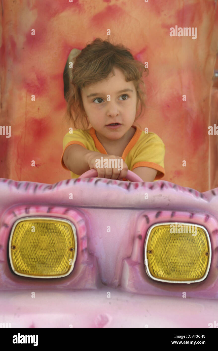 child driving on a toy car Stock Photo - Alamy