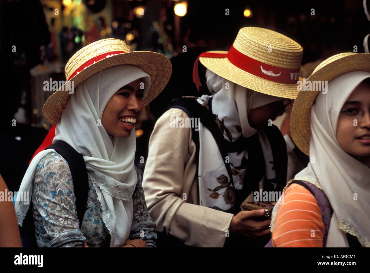Muslim Women wearing headscarves and boaters, Venice, Italy Stock Photo ...