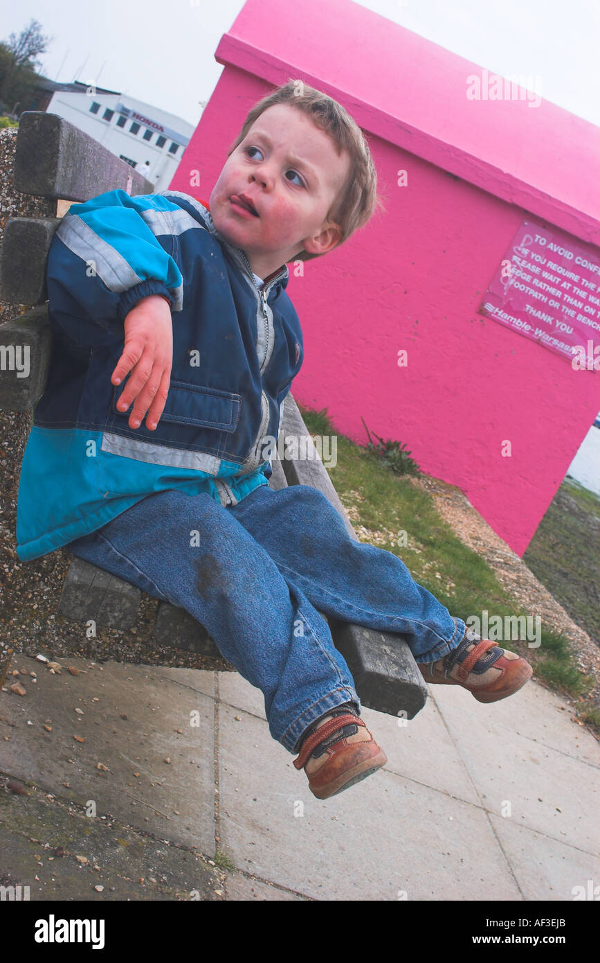 Boy sat on bench hi-res stock photography and images - Alamy