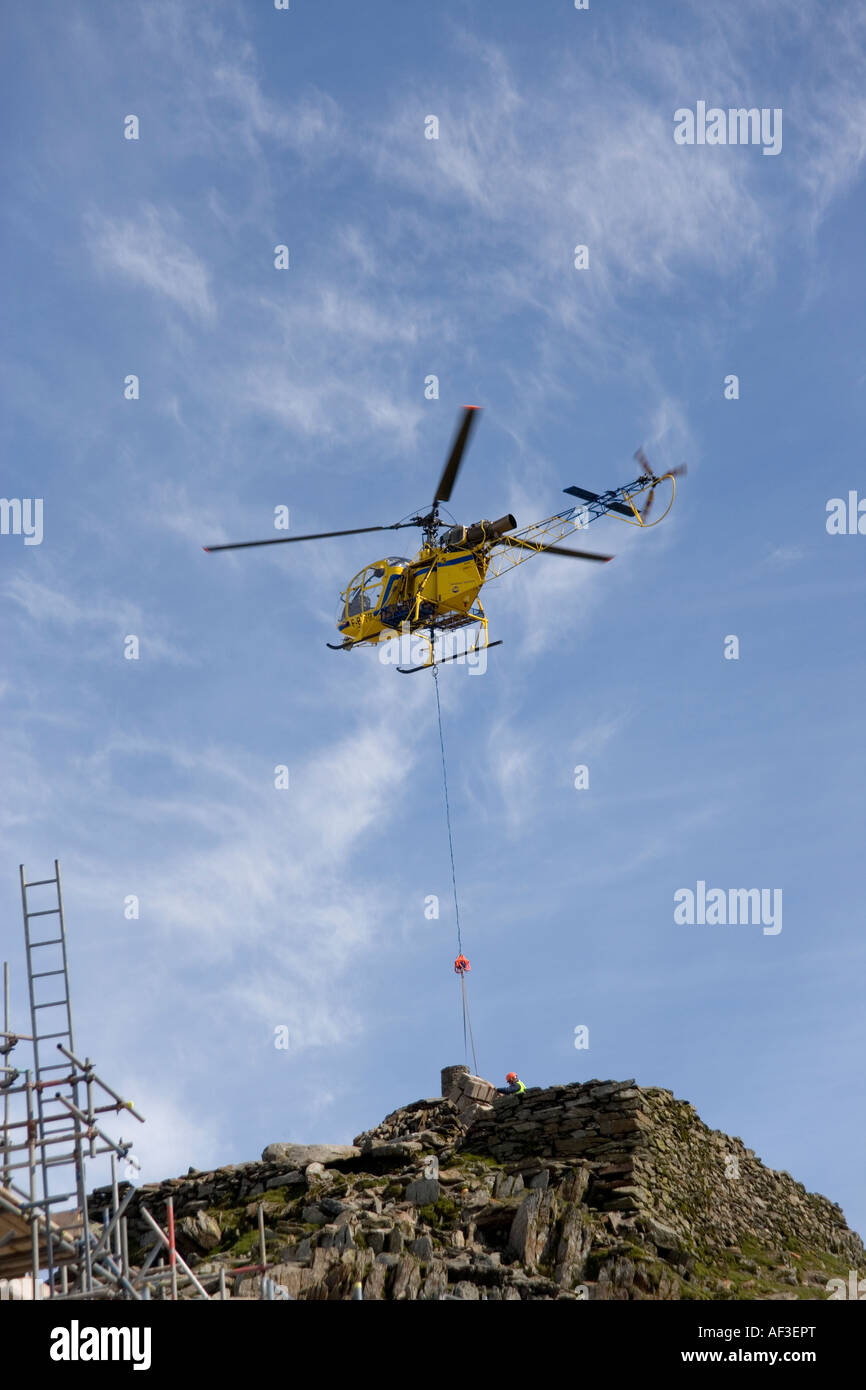 Helicopter flying material to build the new cafe on the top of Snowdon ...