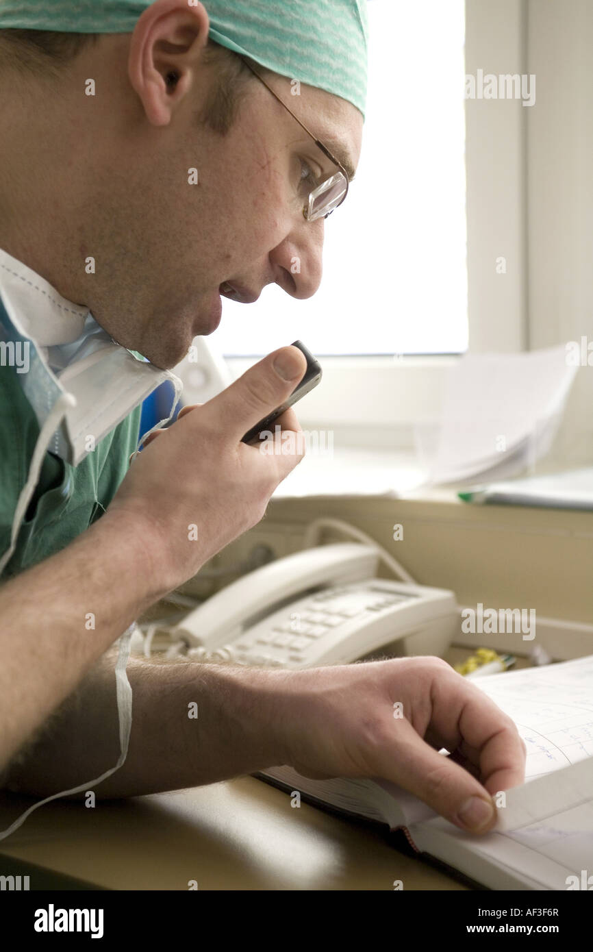 surgeon with voice recorder Stock Photo - Alamy