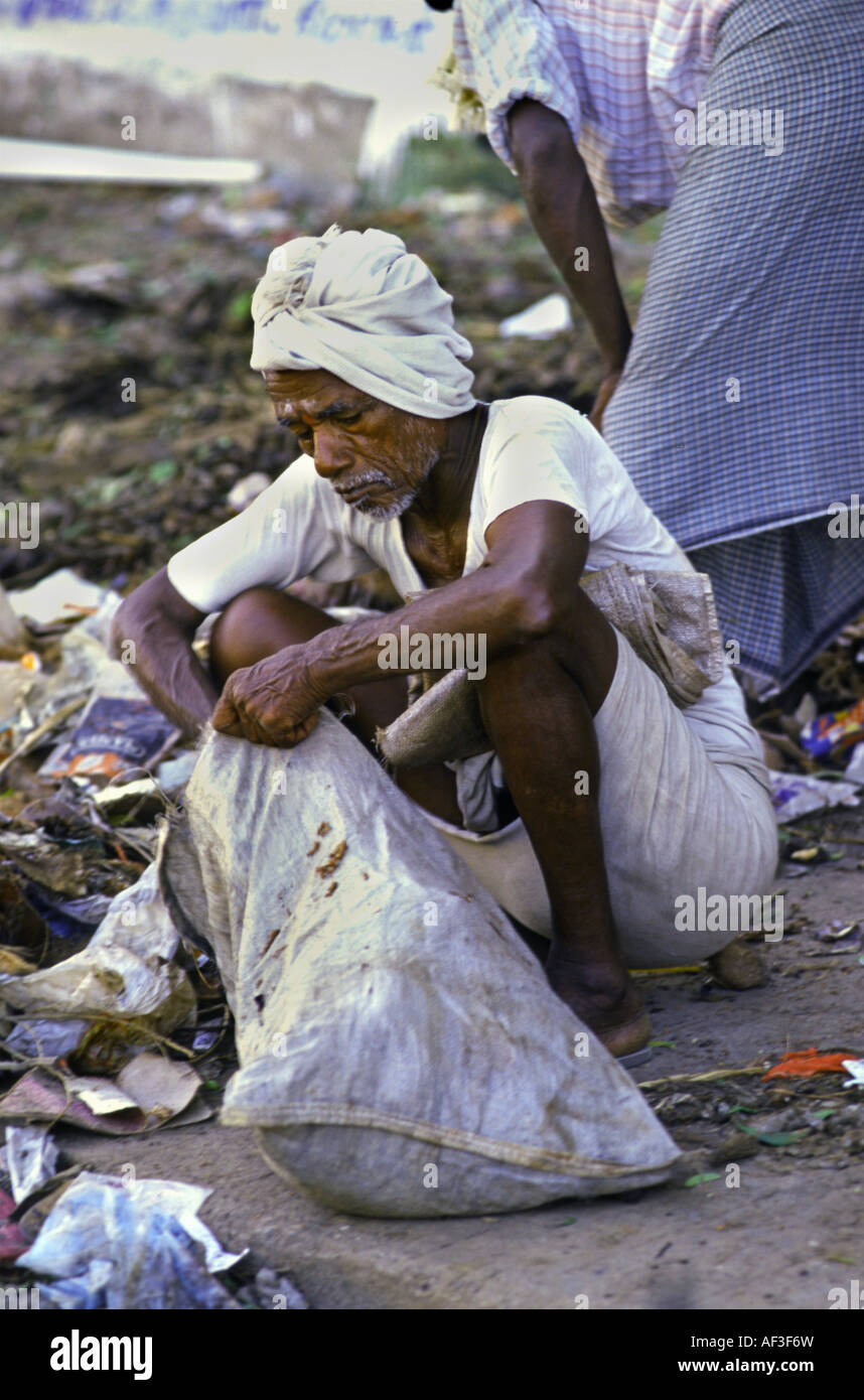 Homeless man searching in garbage hi-res stock photography and images ...