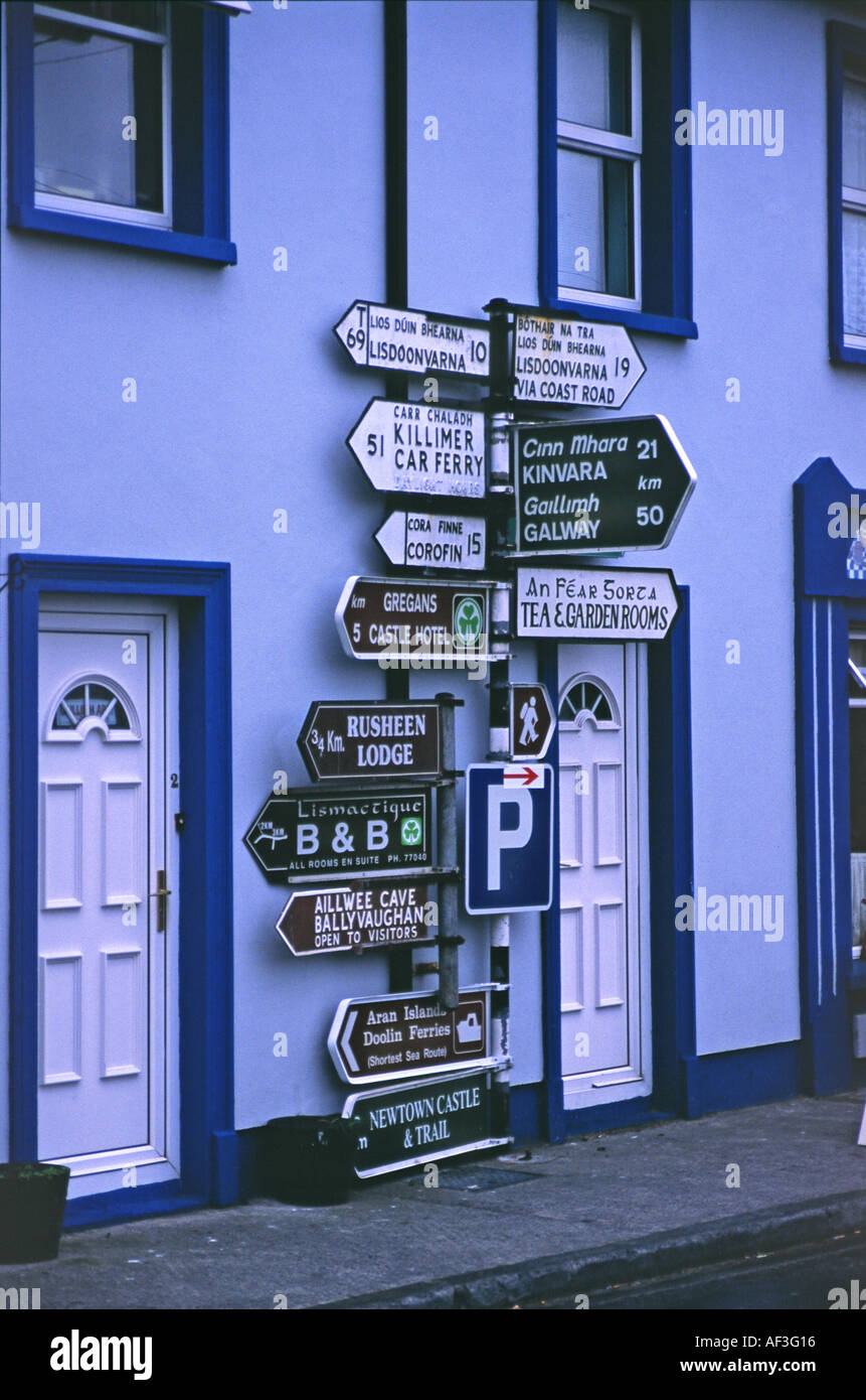 Road sign post in Ireland with directions and distances to Irish towns ...