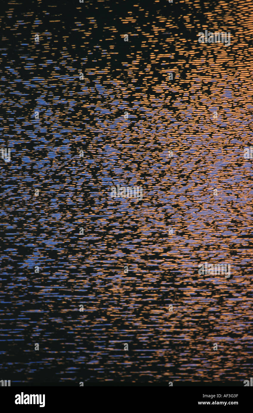 Pattern reflections of coloured light on water ripples Stock Photo - Alamy