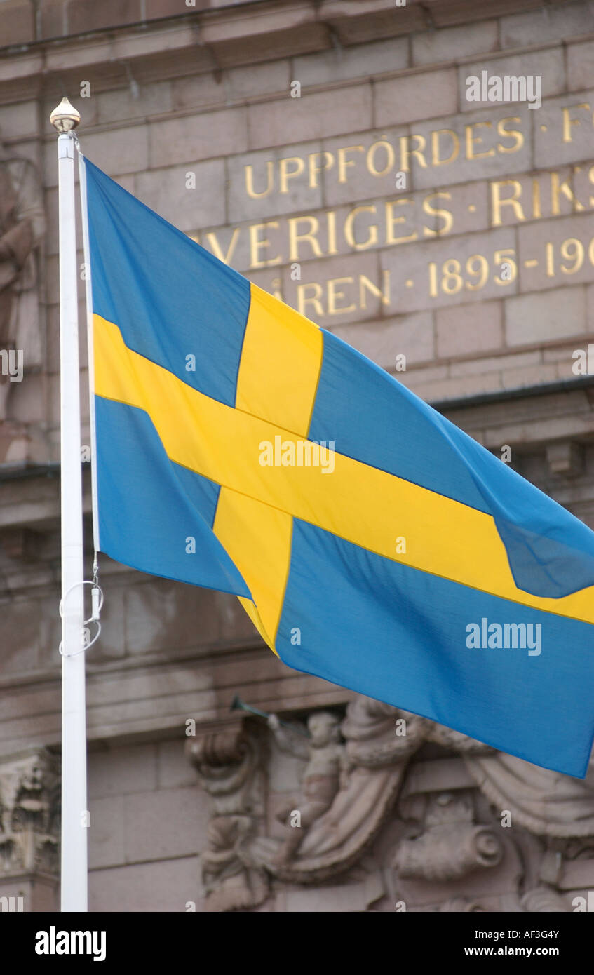 Swedish flag flying outside Stockholm Palace, Stockholm, Sweden Stock ...
