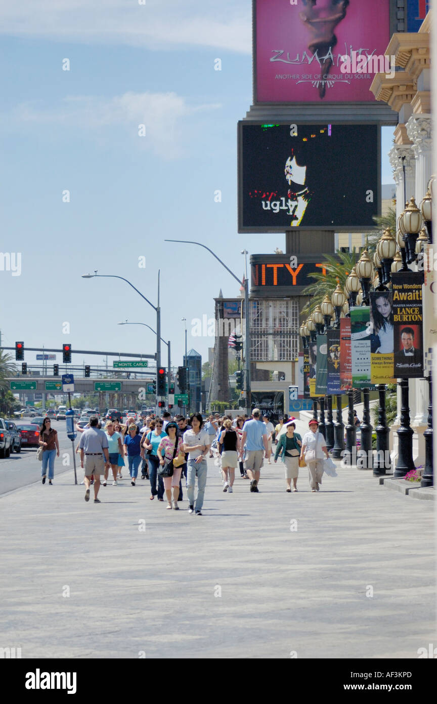 Tourists and other pedestrians on a sidewalk of The Strip in Las Vegas ...