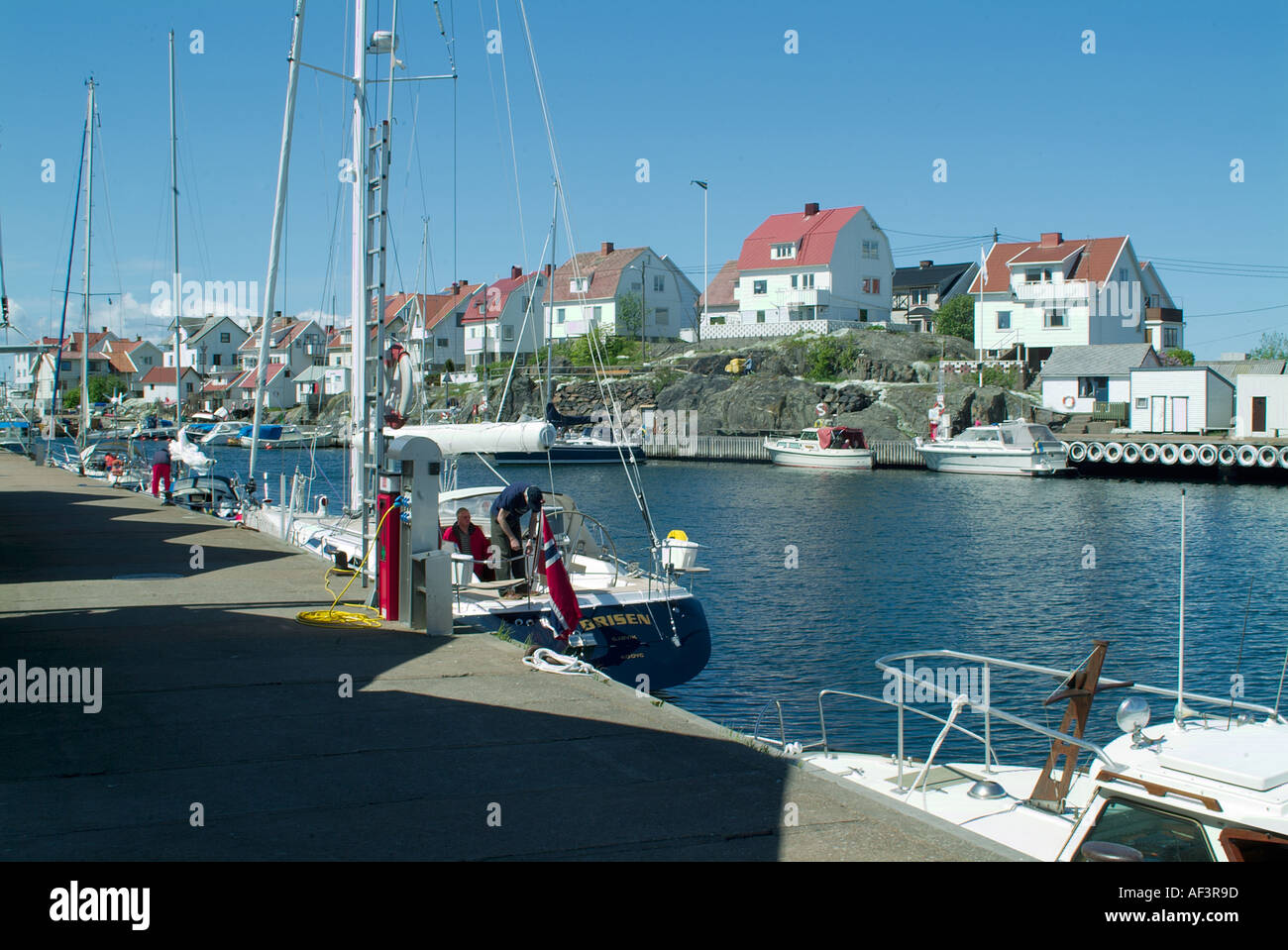 Small harbor filled with boats on island of Åstol on Swedens West Coast ...