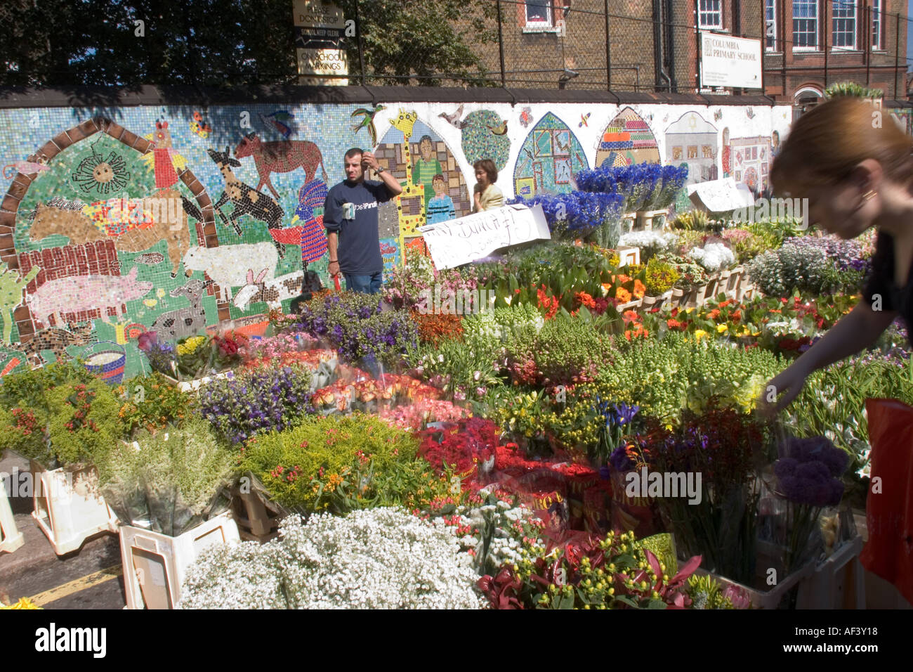 Flower and plant shopping at Columbia Road Sunday Market Hackney Road Shoreditch London GB UK ...
