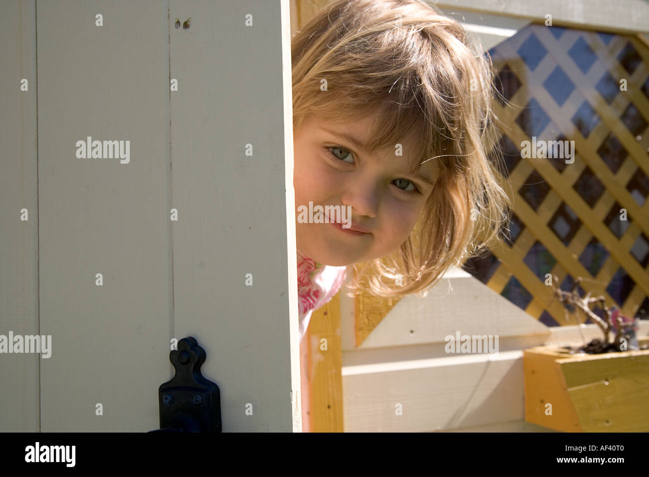 Young girl playing house Stock Photo - Alamy