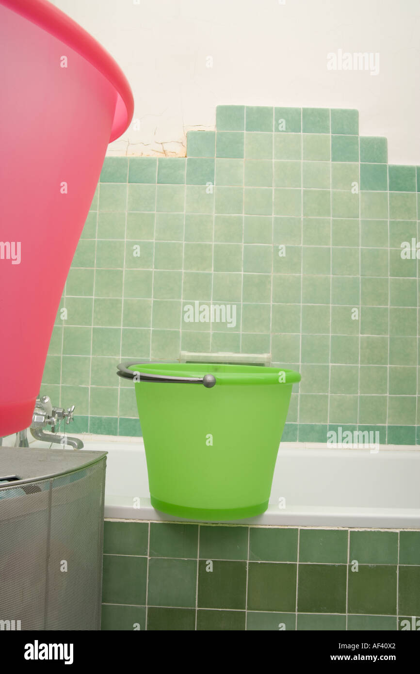 Two buckets on a bath tub Stock Photo - Alamy