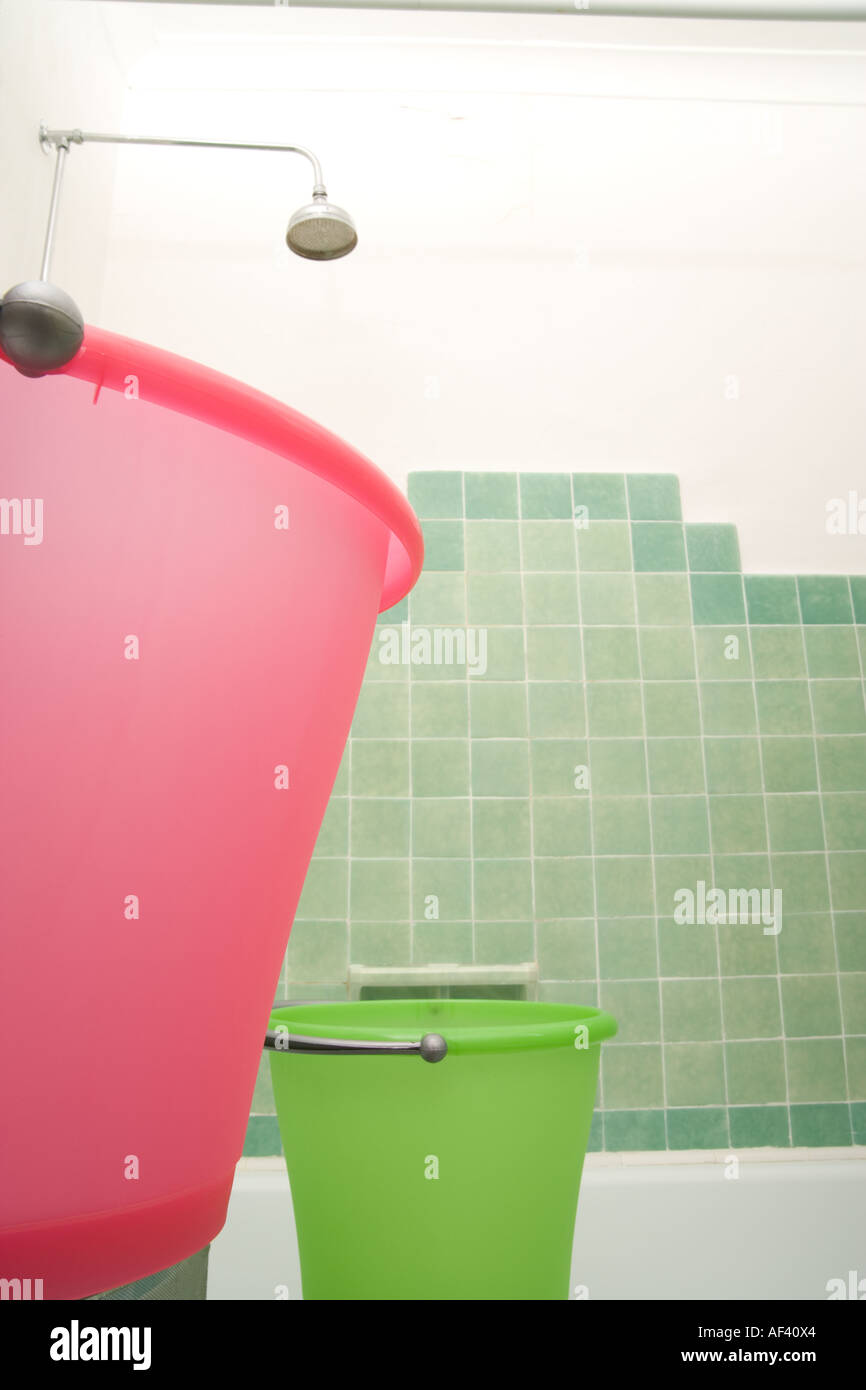 Two buckets on a bath tub Stock Photo - Alamy
