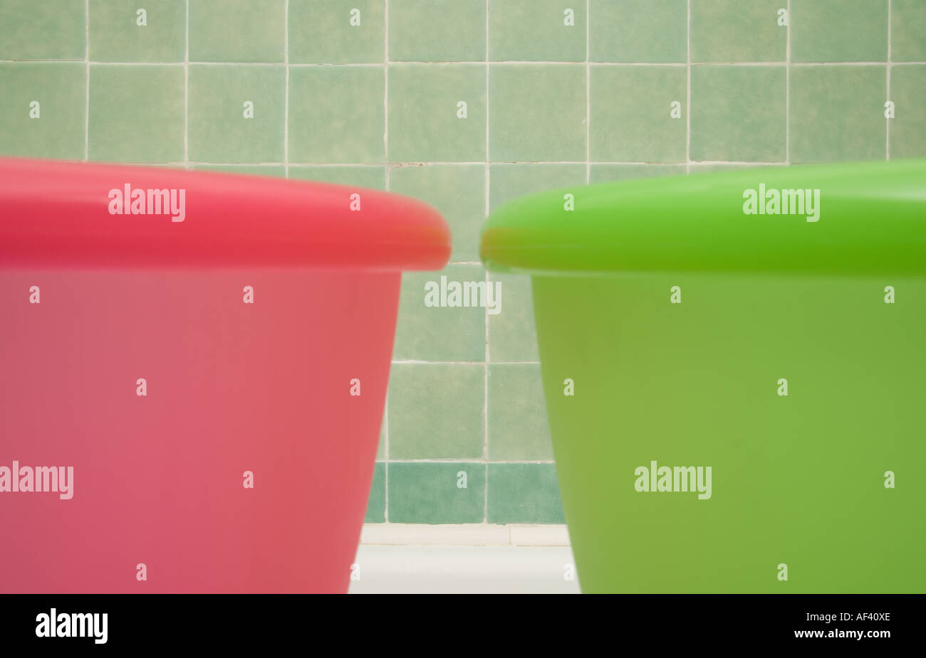 Two buckets on a bath Stock Photo - Alamy