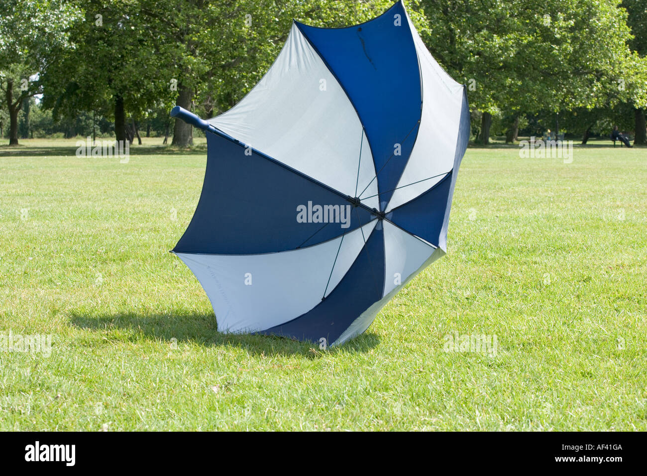 Umbrella blowing in the wind Stock Photo - Alamy
