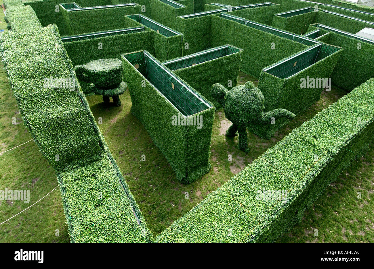 A Topiary Teapot and Teacup wander around a topiary maze Stock Photo ...