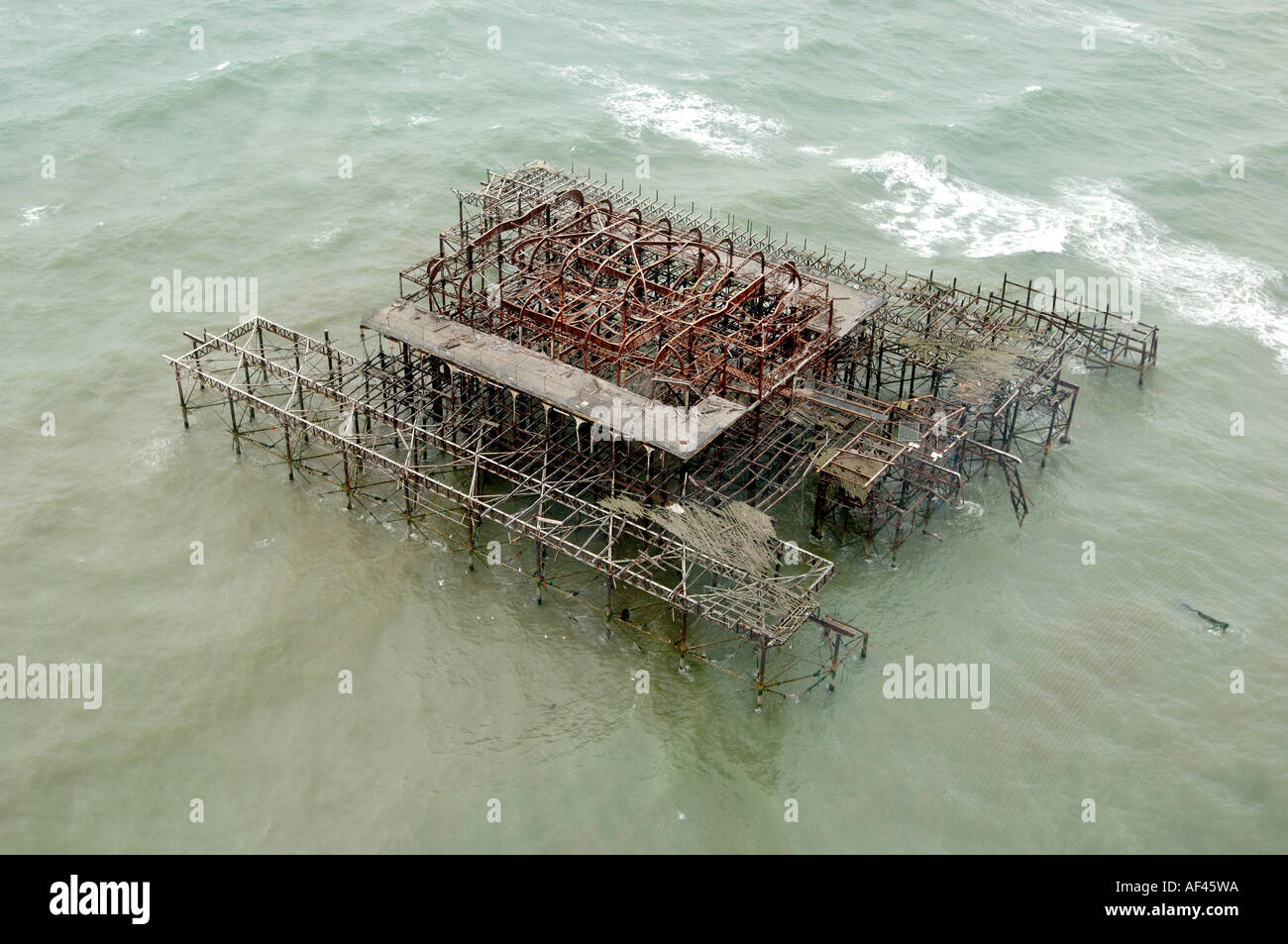 Wreckage of the arson fire damaged Brighton West Pier seen from the air ...