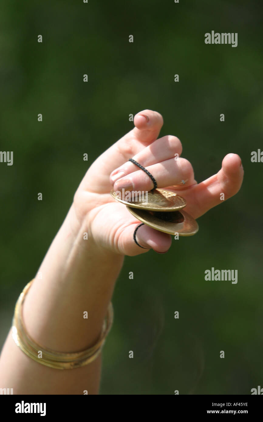 Hand with finger cymbals Stock Photo - Alamy