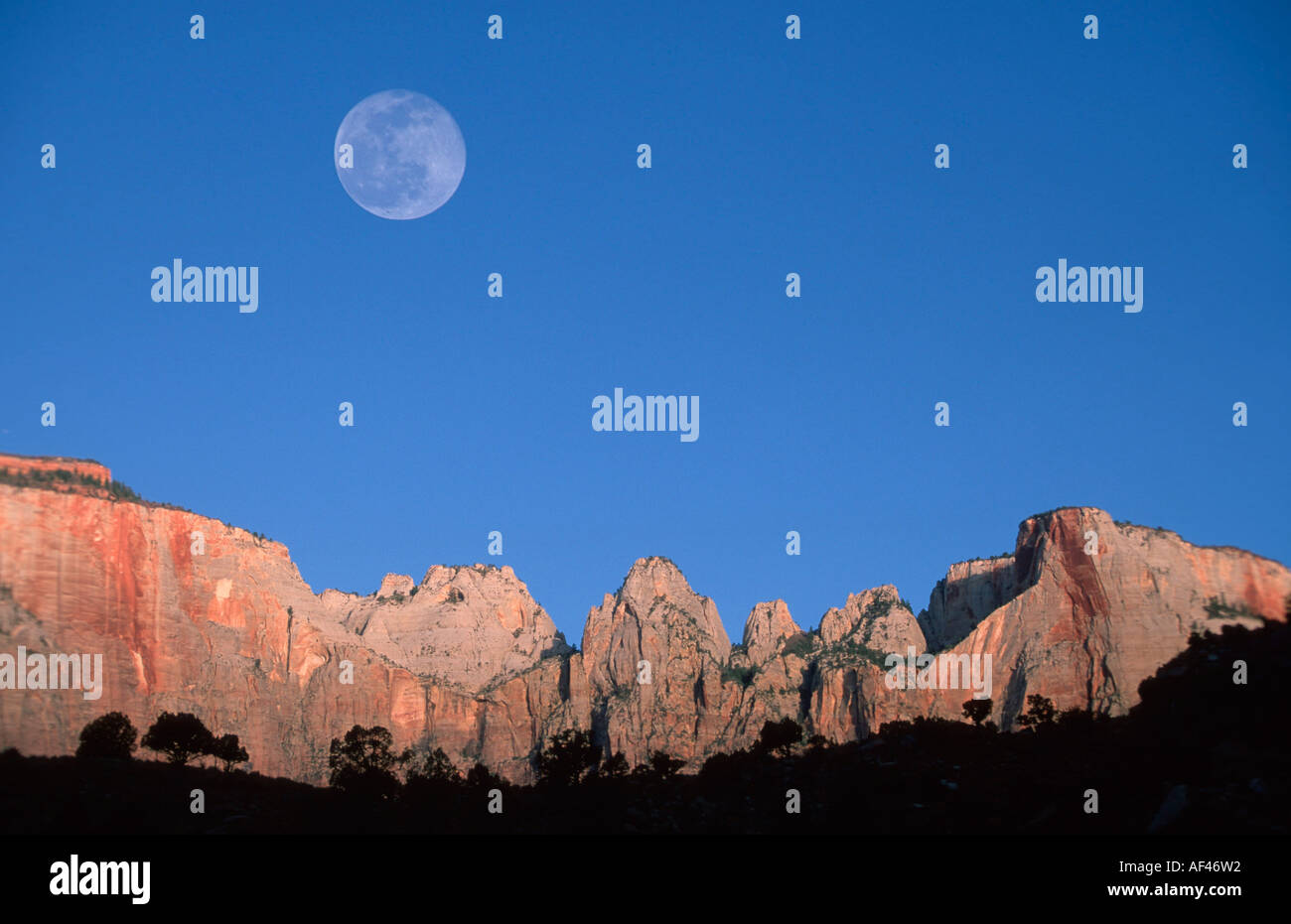 Fullmoon above sandstone formations West Temple and Towers of the ...